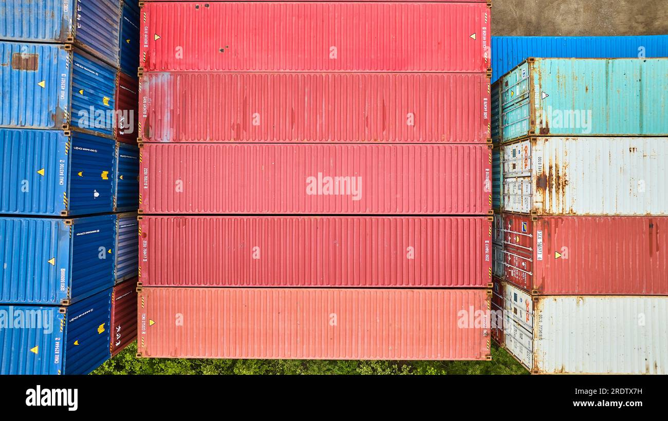 Overhead downward view of pink pastel colored shipping containers in ...