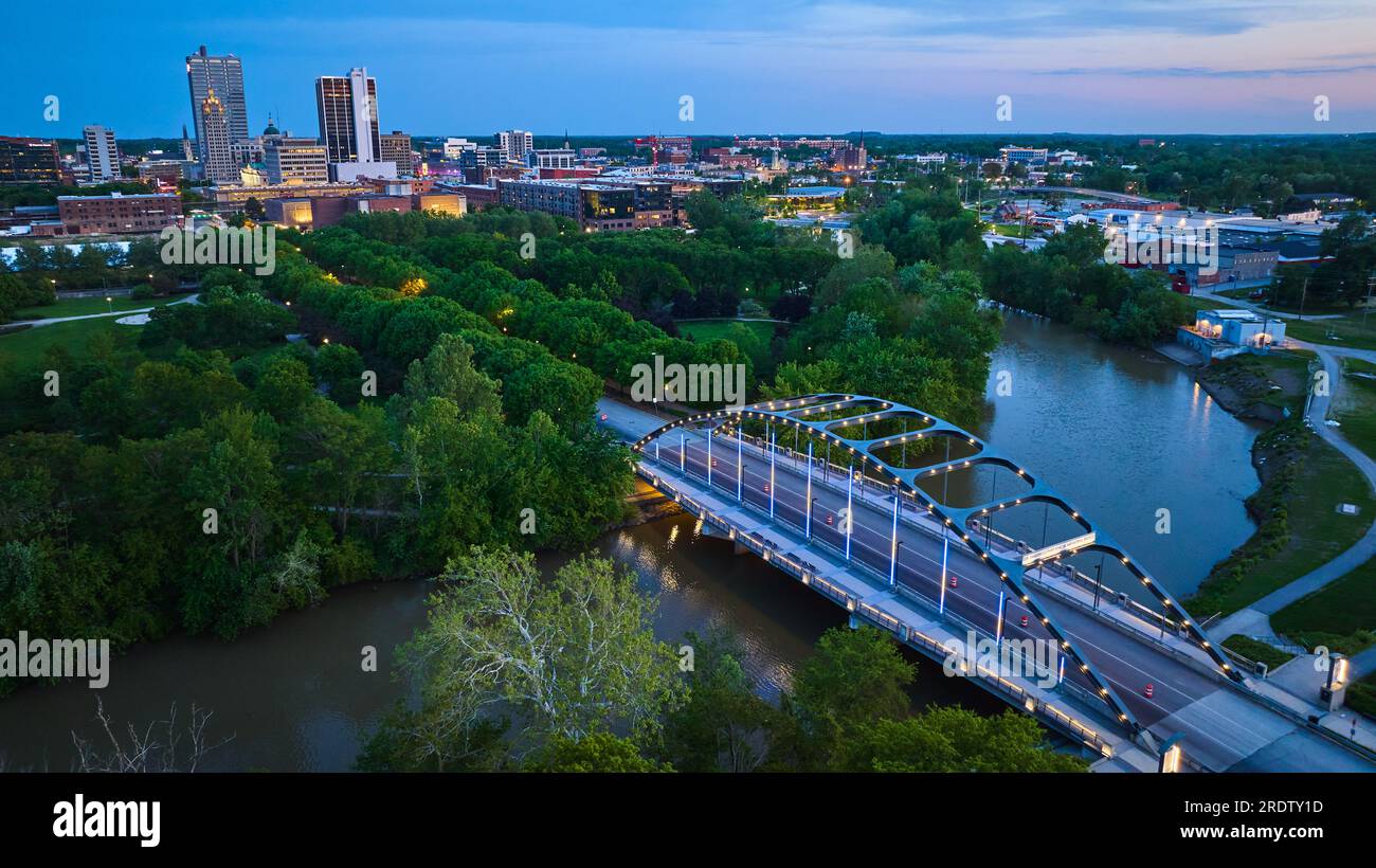 Aerial Martin Luther King Bridge at dusk with city lights and river ...