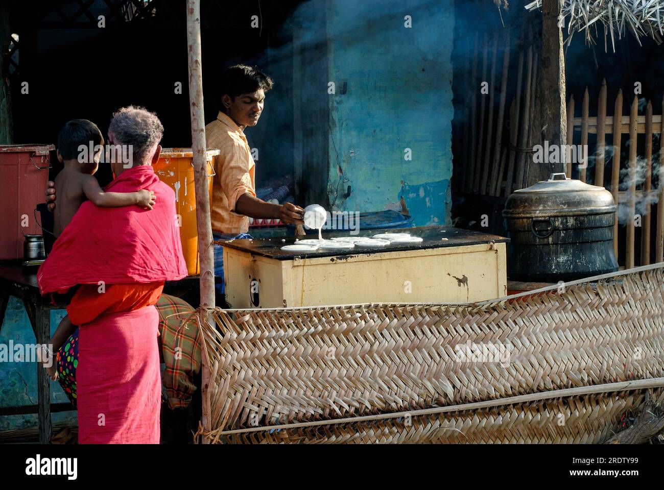 A road side shop man making dosa during Dasara Dussera Dusera Festival ...