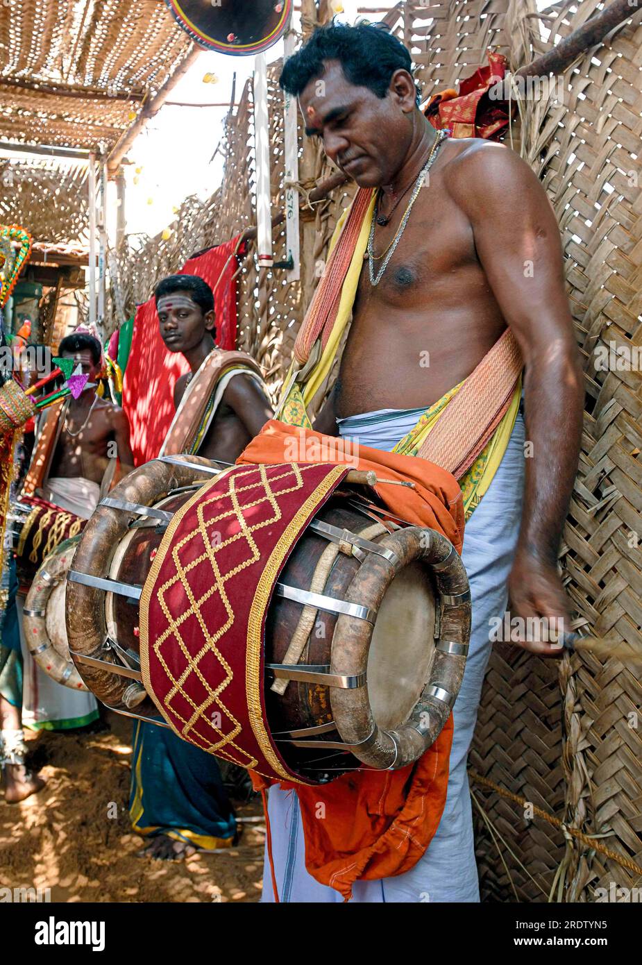 A musician playing Thavil melam percussion in Dasara Dussera Dusera ...