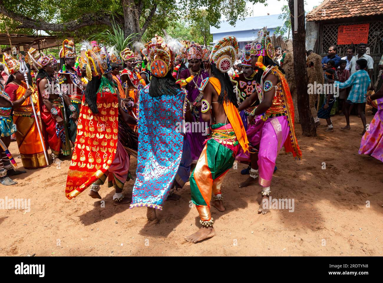 Dancing Men wearing exaggerate costumes for the purpose of offering ...