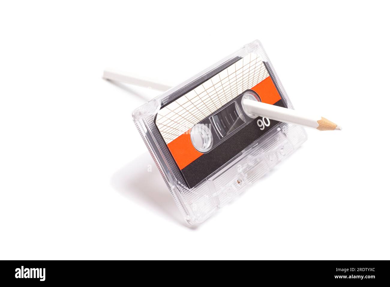 Audio cassette tape with pencil isolated on white background, vintage ...