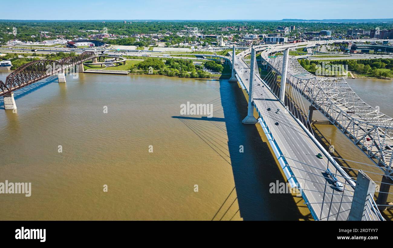 Ohio River aerial with suspension, truss, arch bridges leading to ...