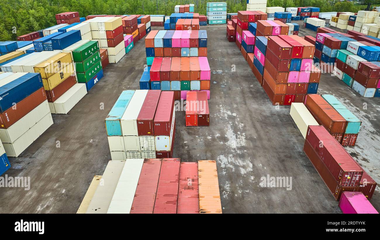 Pastel colored shipping containers aerial, rows of colorful semi truck ...