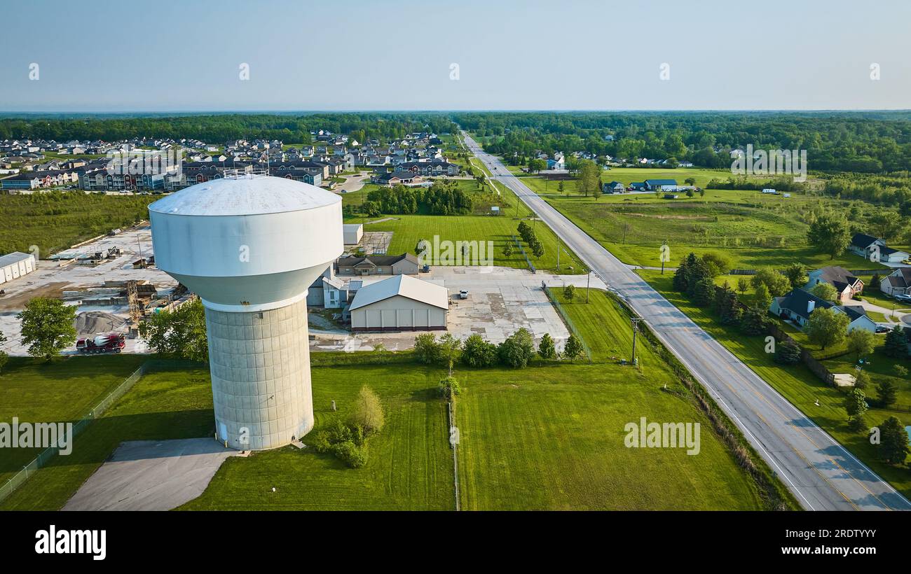 Rural area with housing and nondescript white water tower aerial Stock ...