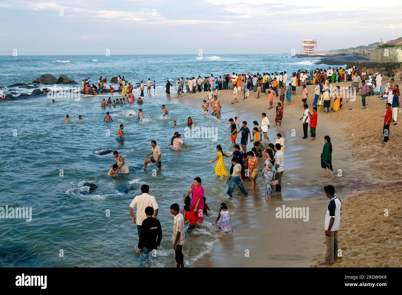 People bathing and enjoying in the beach at meeting of three seas Bay ...