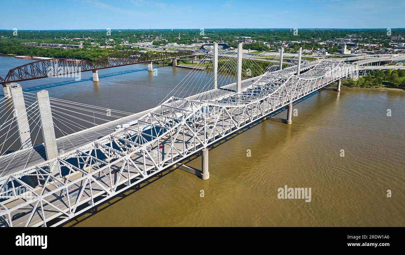 Concrete and iron suspension and truss bridges over dirty water of Ohio ...