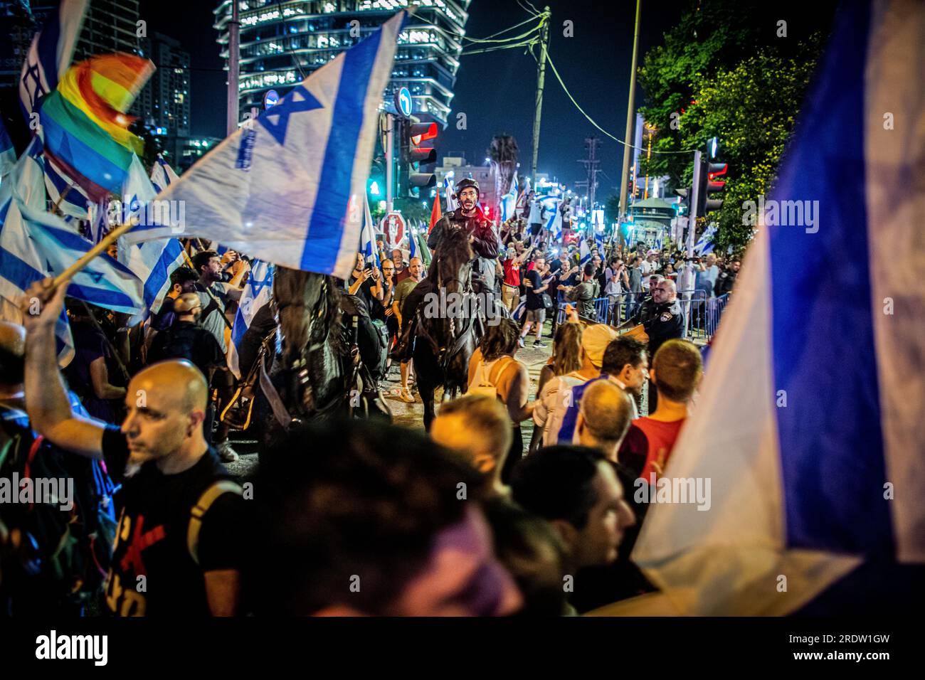 Israeli horse mounted police officers try to control a a crowd of anti ...