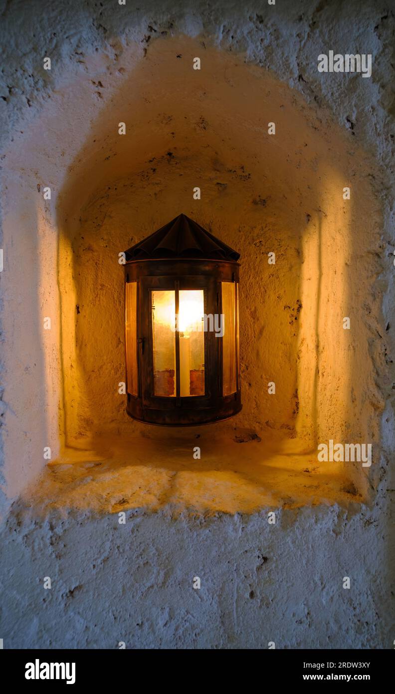 Woman lighting candle in morning hi-res stock photography and images ...