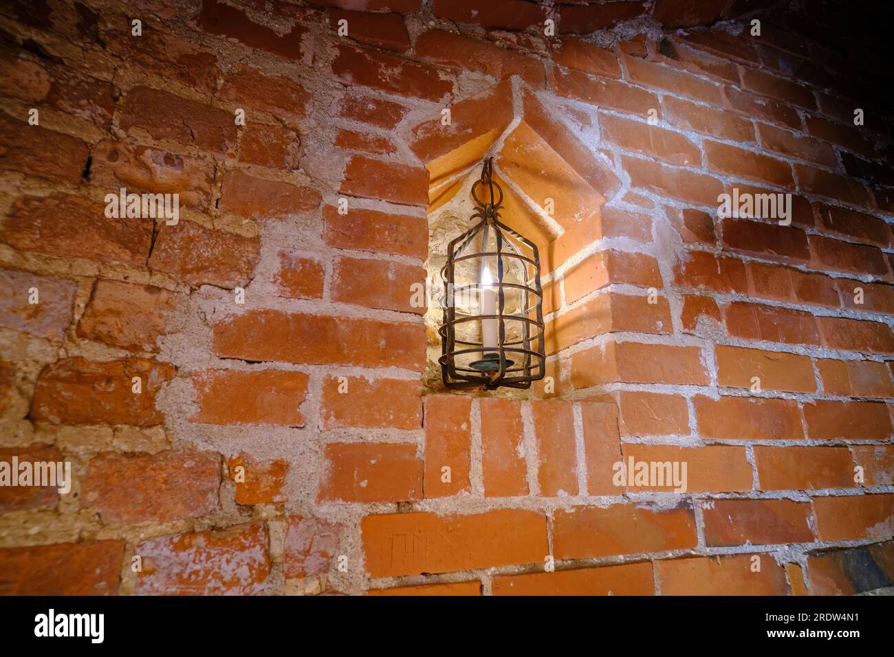 Red brick wall texture with candle niche background Stock Photo - Alamy