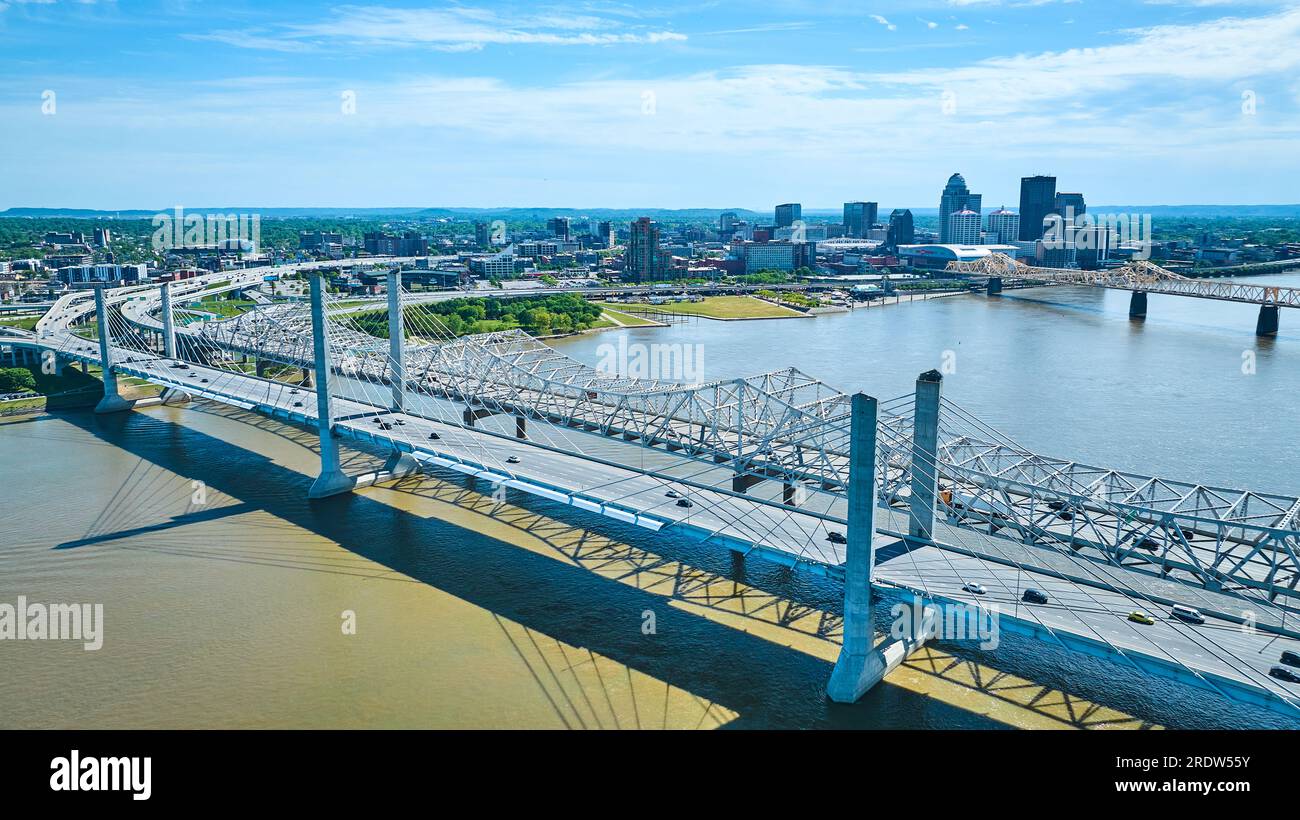 Two suspension bridges over Ohio River downtown Louisville KYskyscraper ...