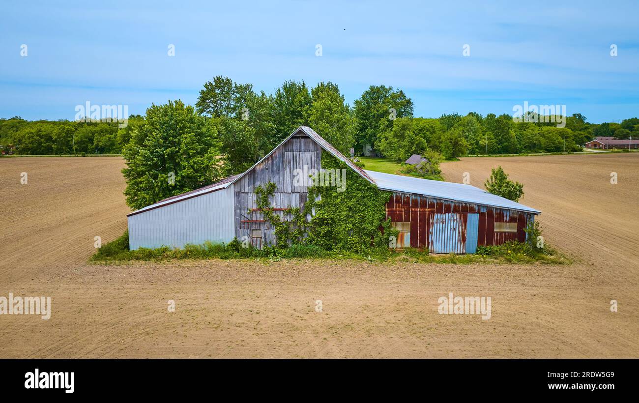 Aerial dirt farmland with old barn with ivy growing on it Stock Photo ...