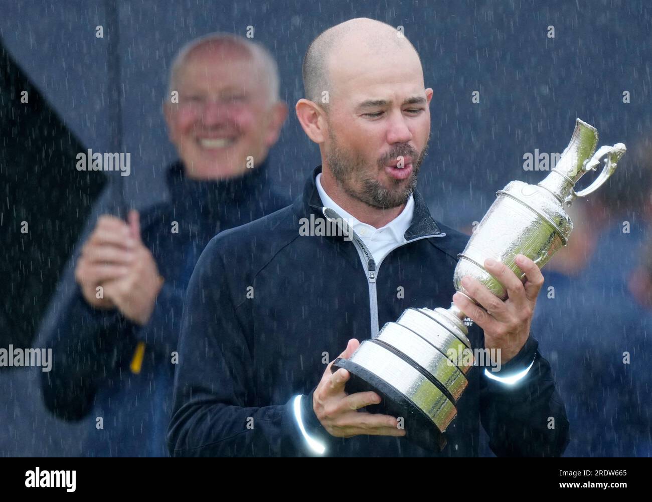 United States' Brian Harman reacts as he holds the Claret Jug trophy of ...
