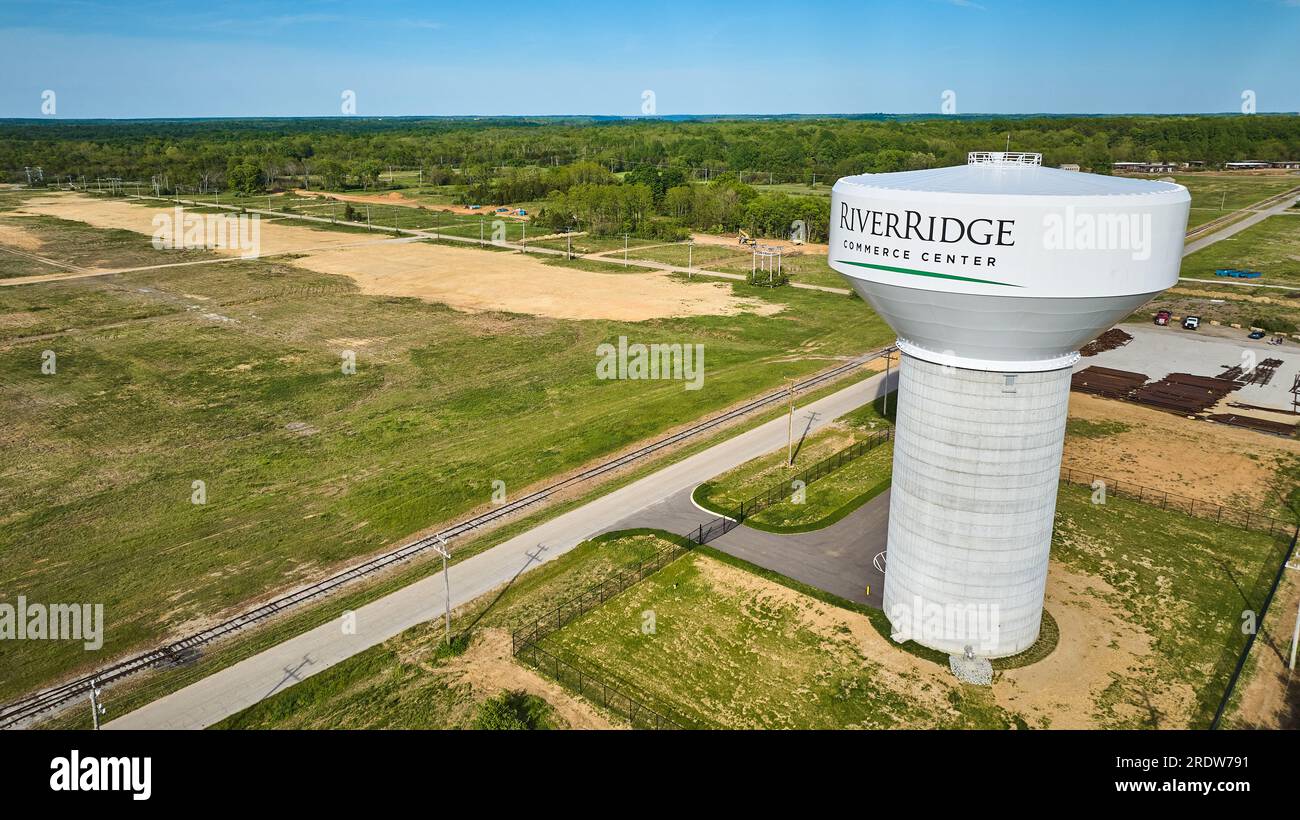 Riverridge water tower over green grassy farmland fields aerial Stock ...