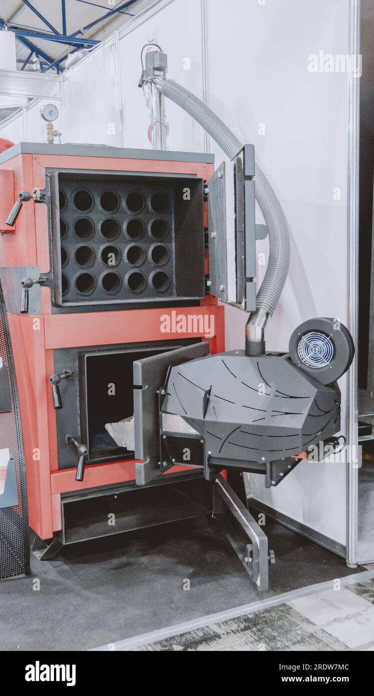 Heating boiler for solid fuel with turbocharging Stock Photo - Alamy
