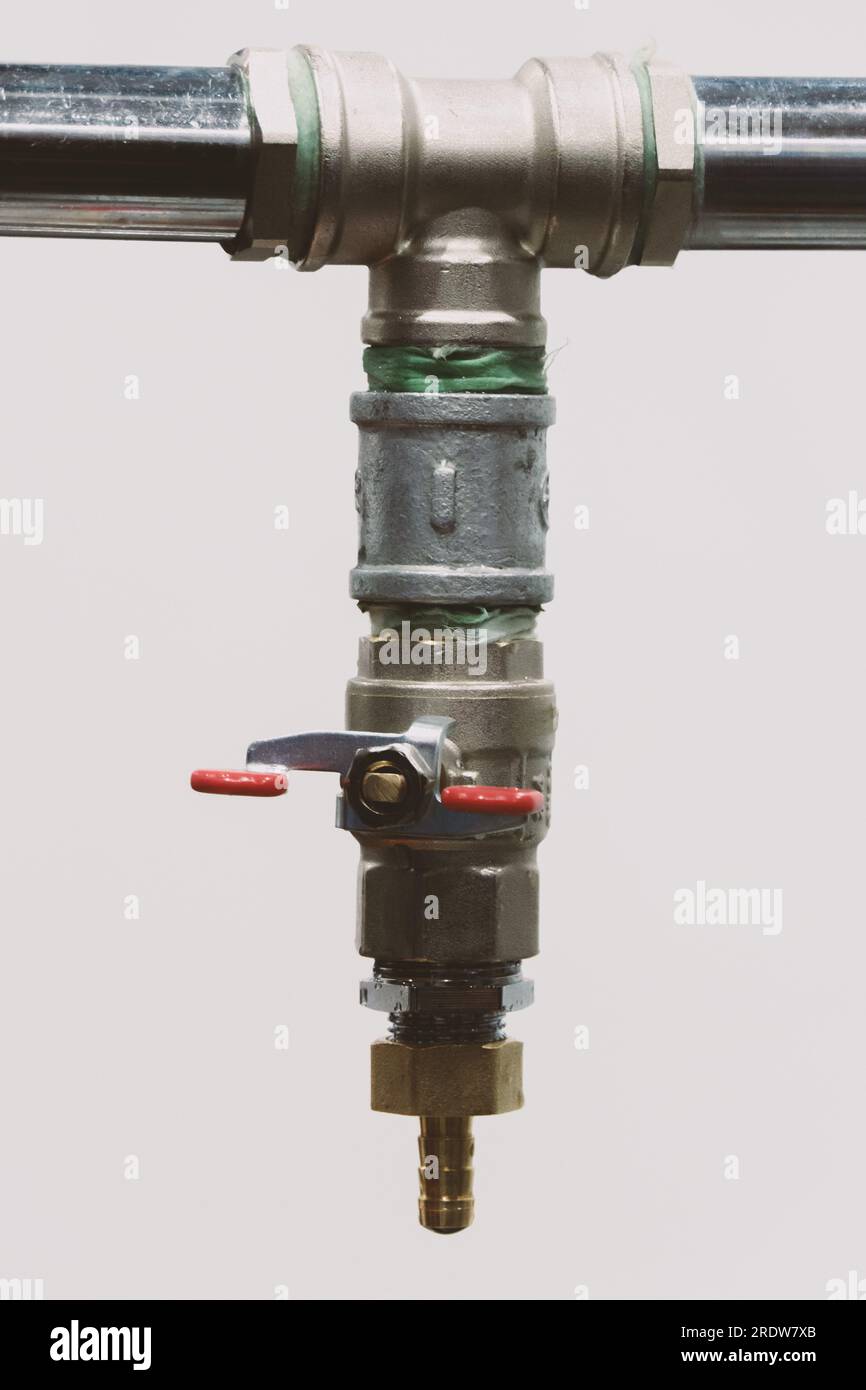 Tight ball valve connections on the pipe Stock Photo - Alamy