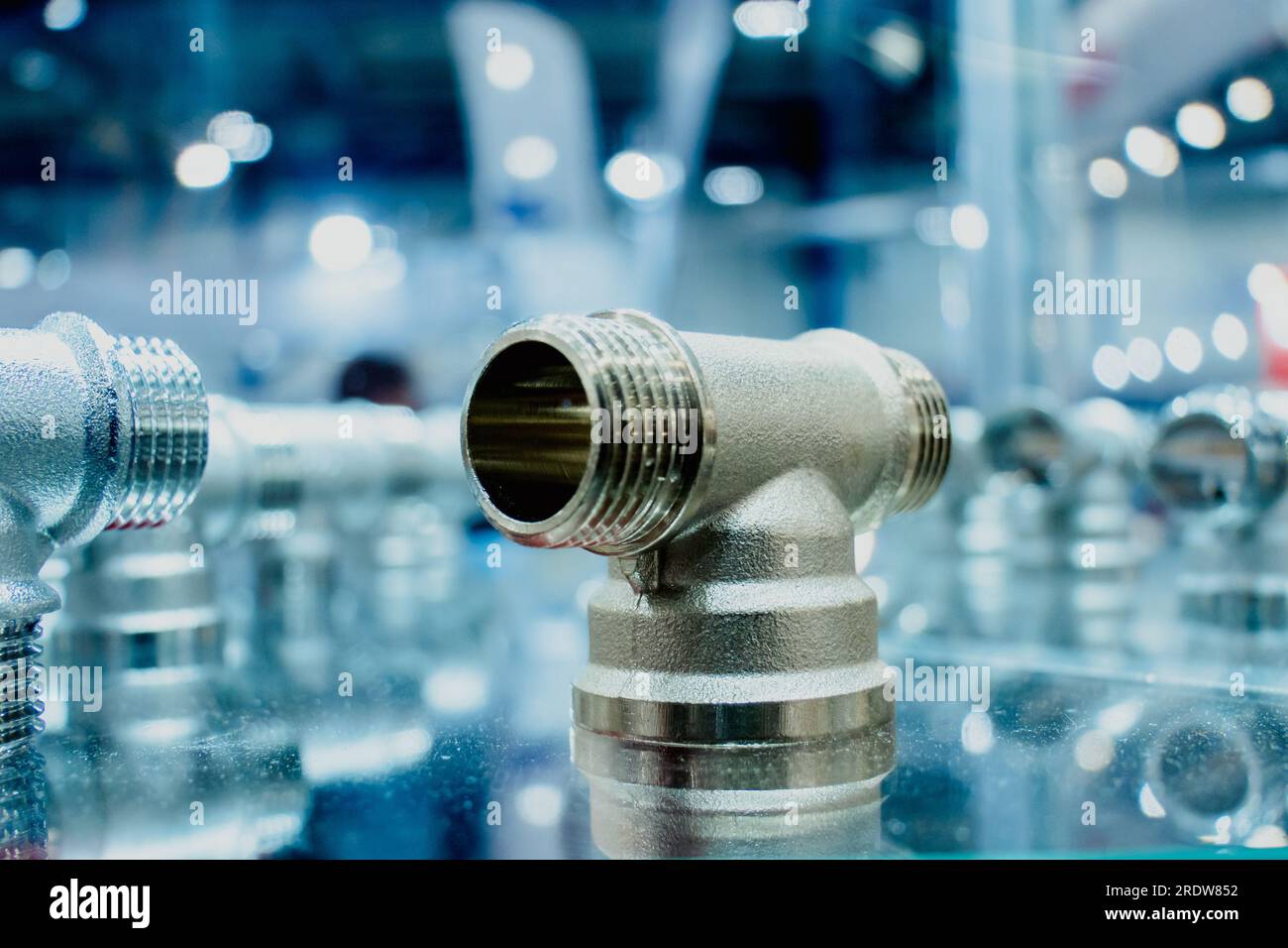 Threaded steel tee for connecting pipes Stock Photo - Alamy