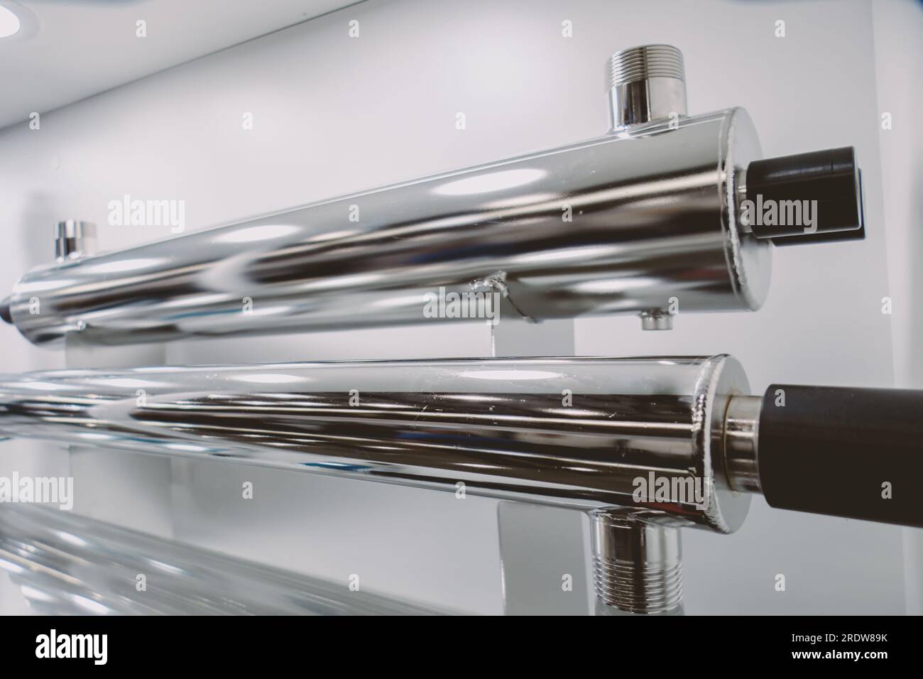Round shiny stainless steel pipes Stock Photo - Alamy