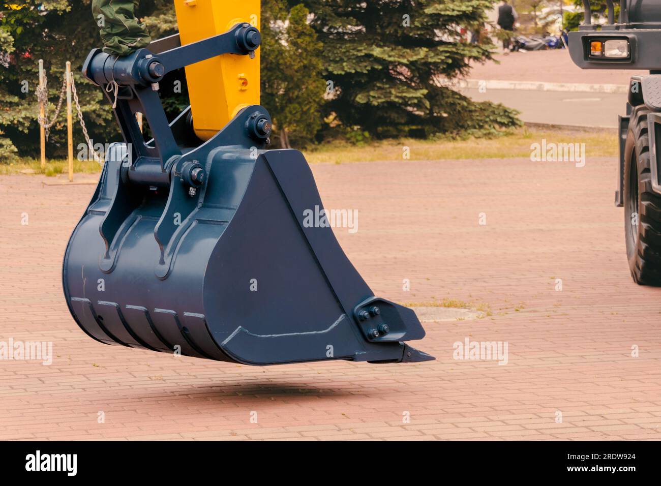 Metal bucket of an excavator close-up Stock Photo - Alamy