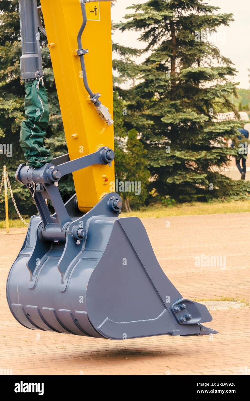 Metal bucket of an excavator close-up Stock Photo - Alamy