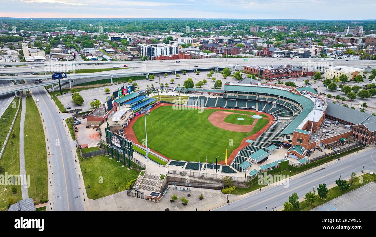 Summer green Louisville Slugger Field baseball diamond aerial with city ...