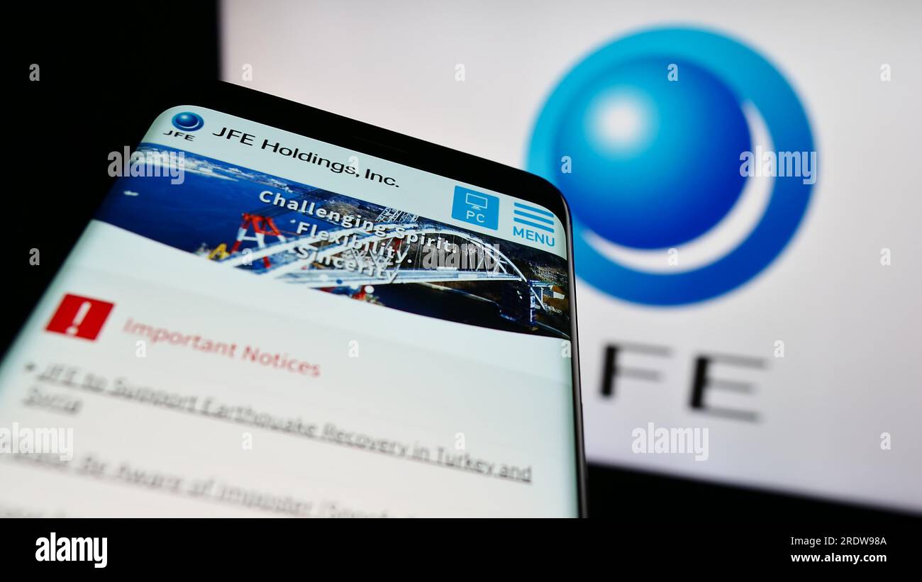 Smartphone with webpage of Japanese steel company JFE Holdings Inc. on screen in front of ...