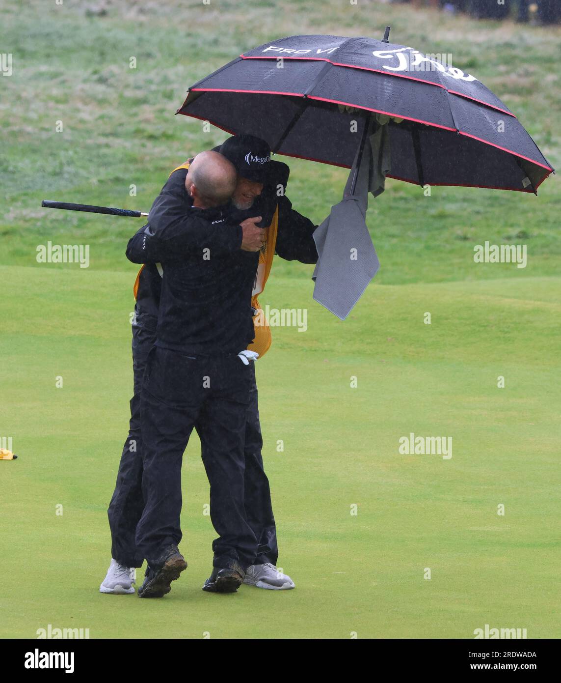 Hoylake, UK. 23rd July, 2023. American Brian Harman embraces his caddy ...