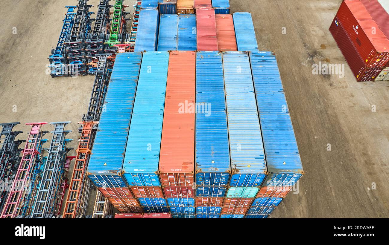 Wall of stacked metal shipping containers, container port aerial Stock ...