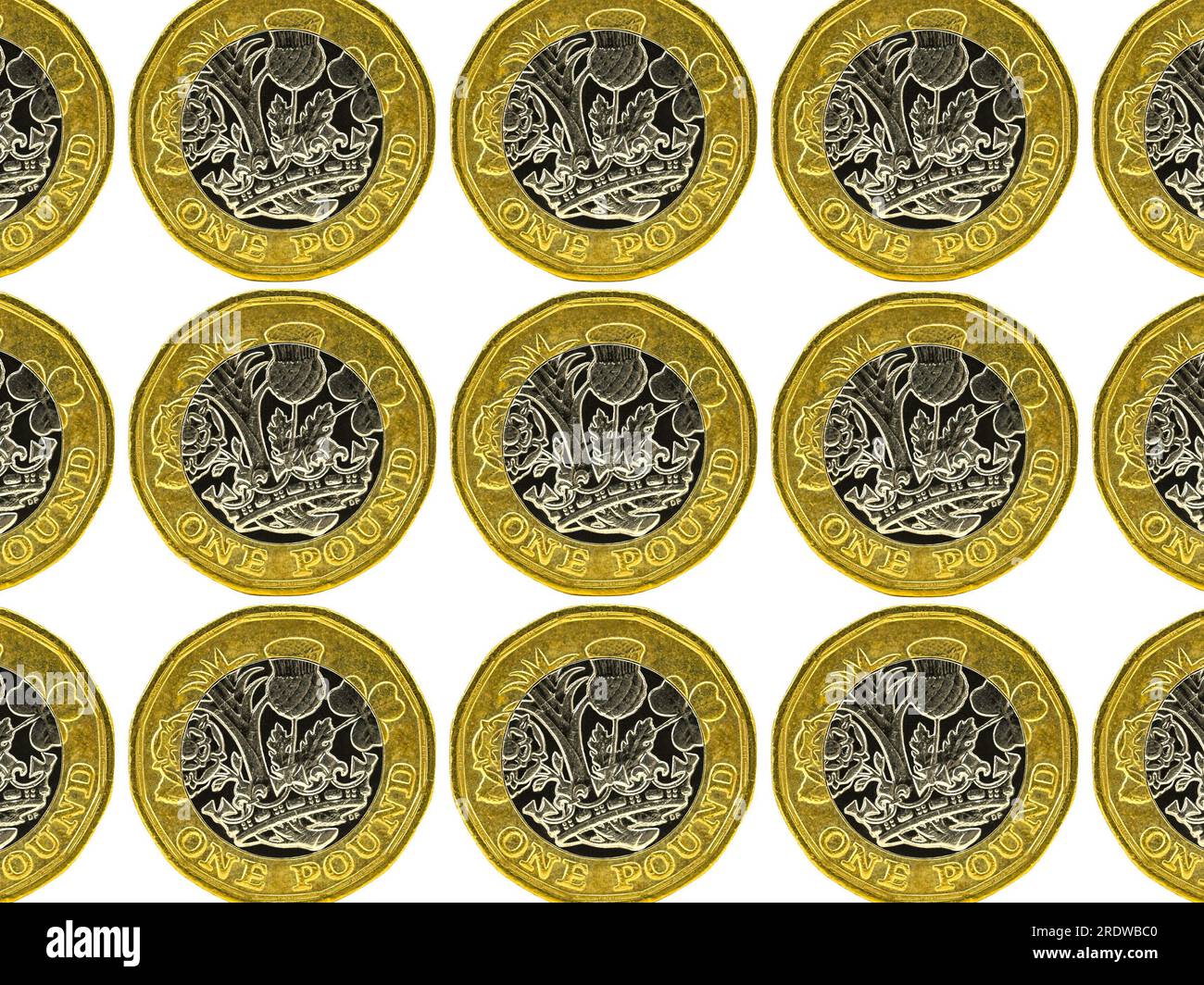 Close up view of rows of British one pound coins on a plain white ...