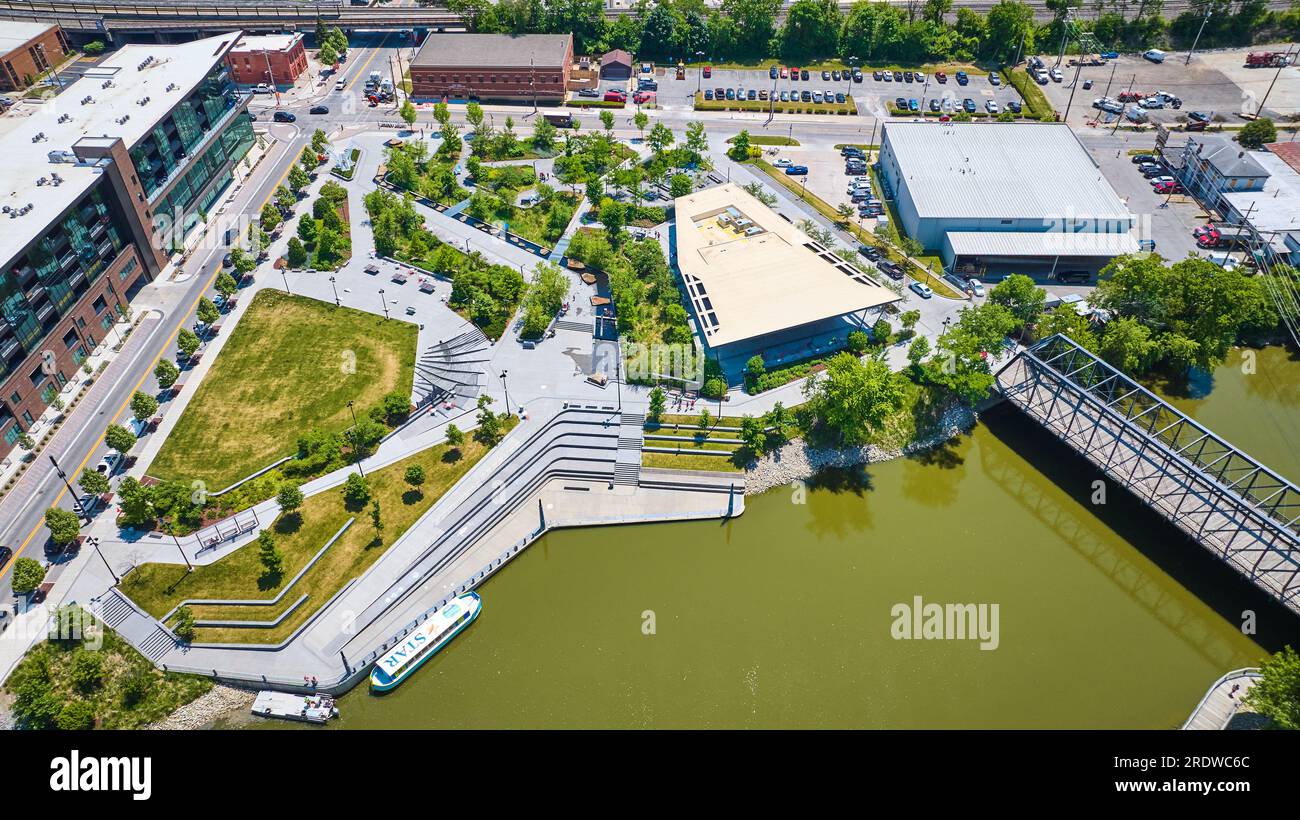 Aerial over St. Marys River at Promenade Park with Wells Street Bridge ...