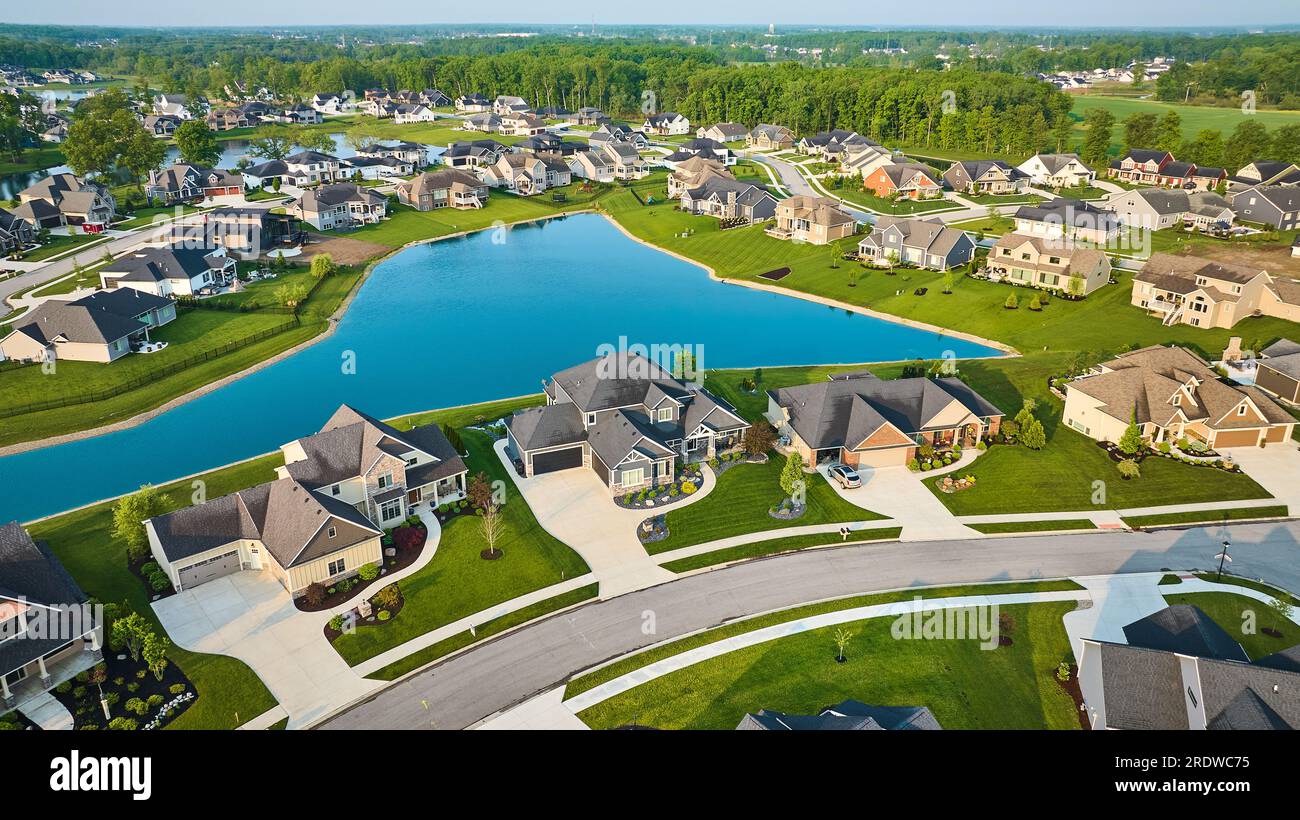 Massive blue pond rich neighborhood million-dollar homes mini mansions ...