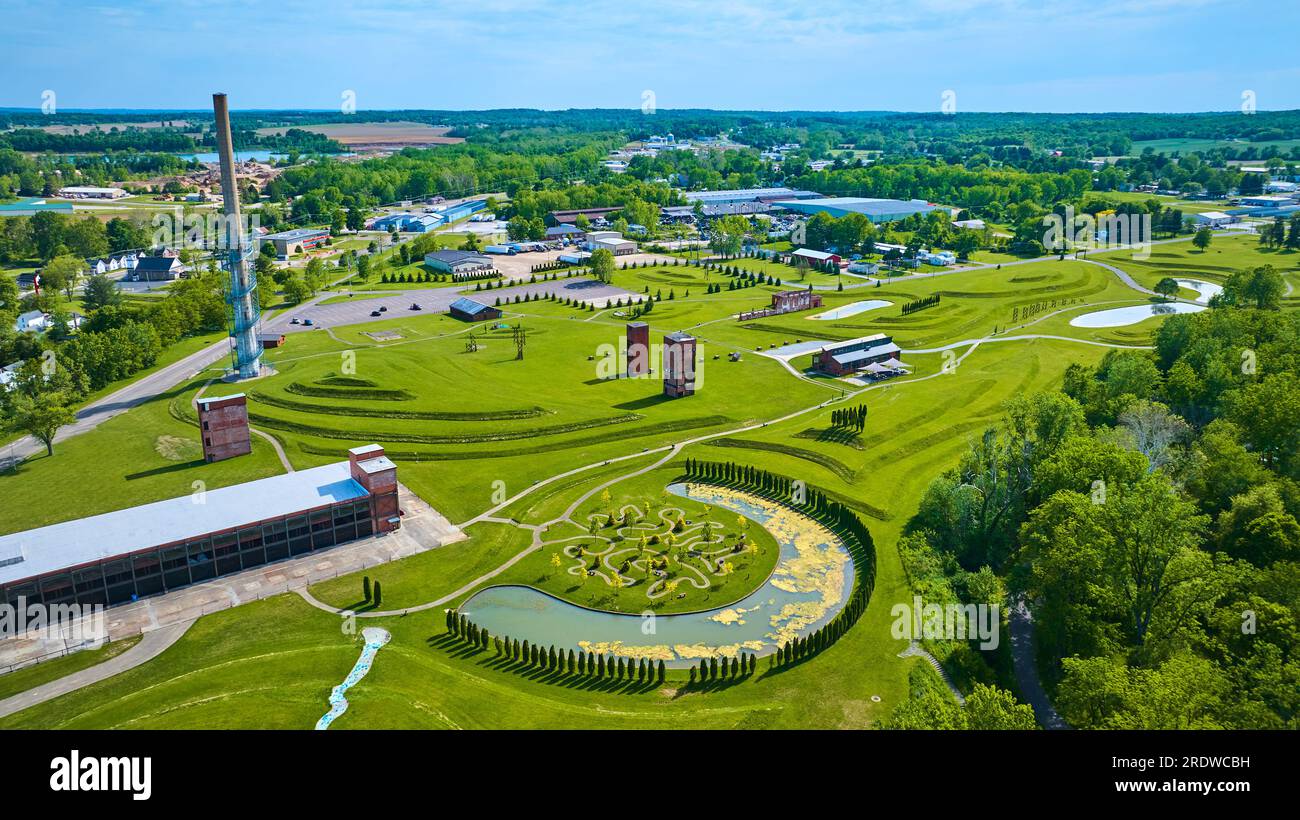 Ariel Foundation Park aerial with old factory structures and park tree ...