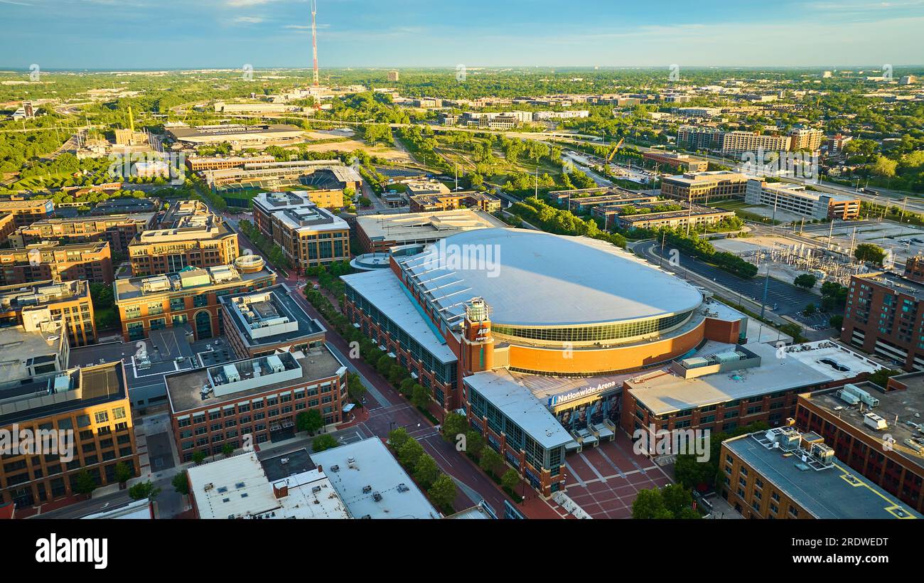 Golden sunrise over Nationwide Arena and land around it in aerial of ...