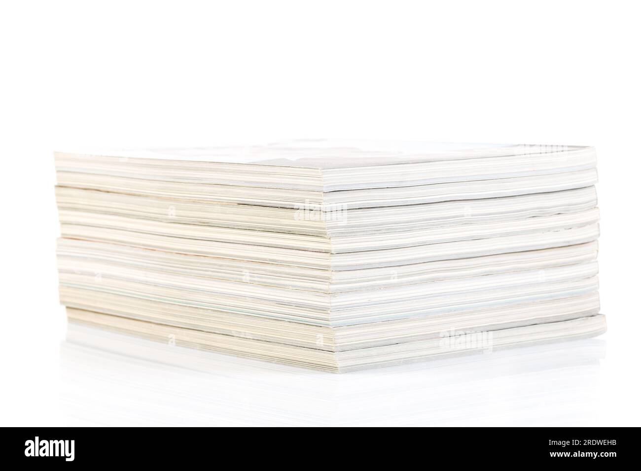 A stack of magazines isolated on a white background Stock Photo - Alamy