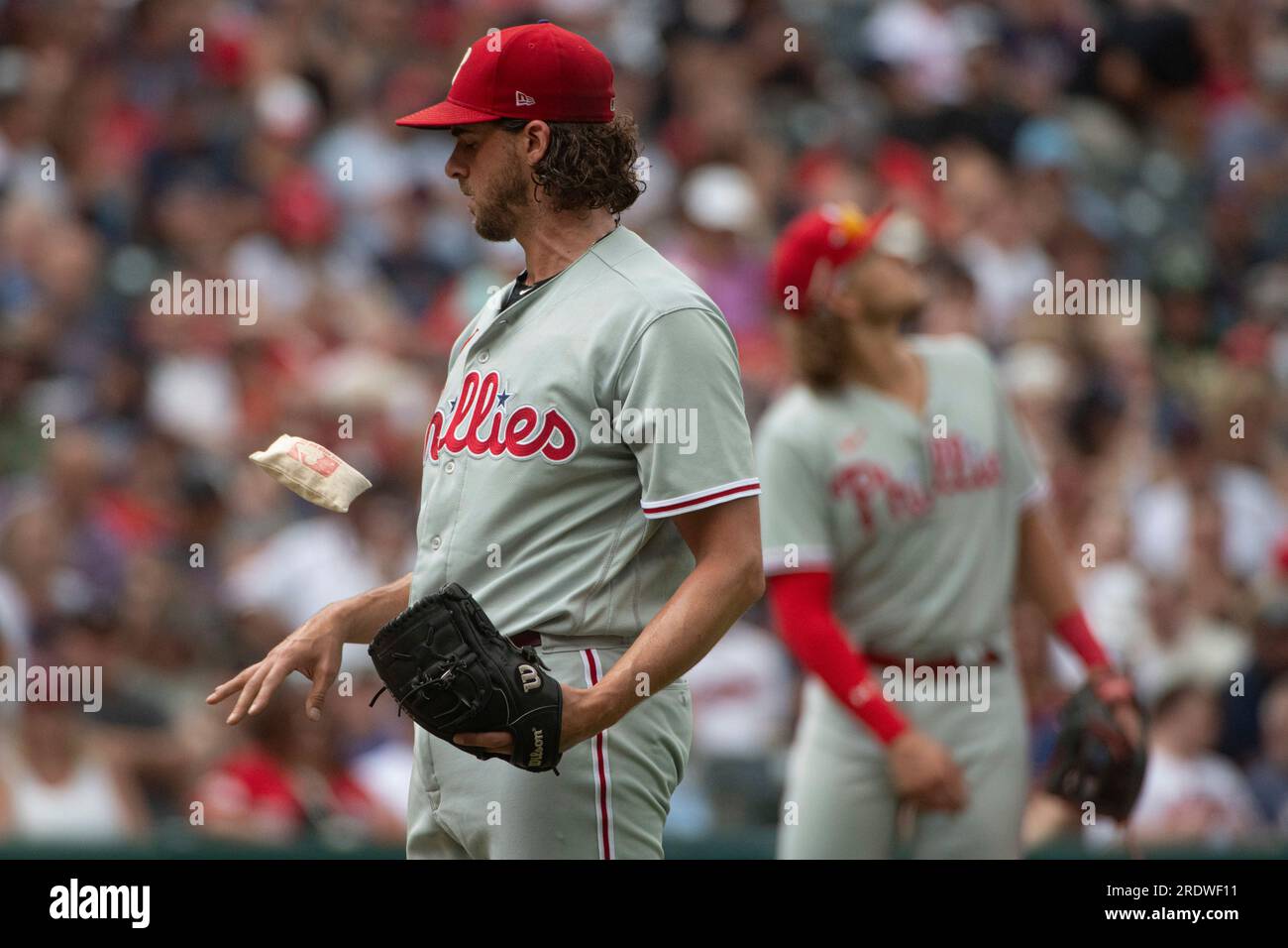 Philadelphia Phillies starting pitcher Aaron Nola flips the resin bag ...