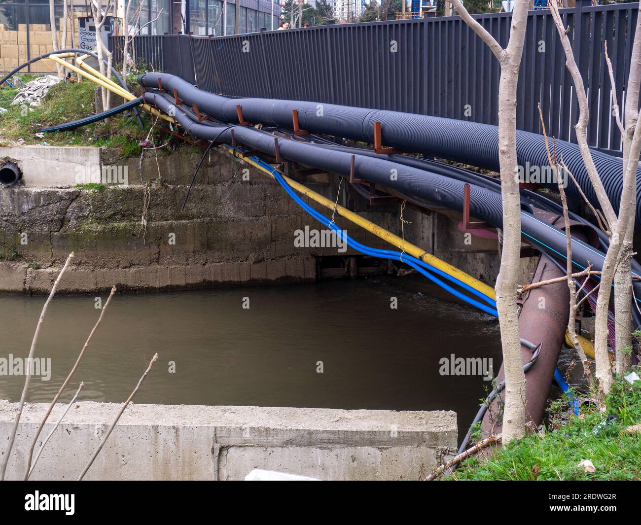 Communications go under the bridge on the river. Wires and pipes under ...