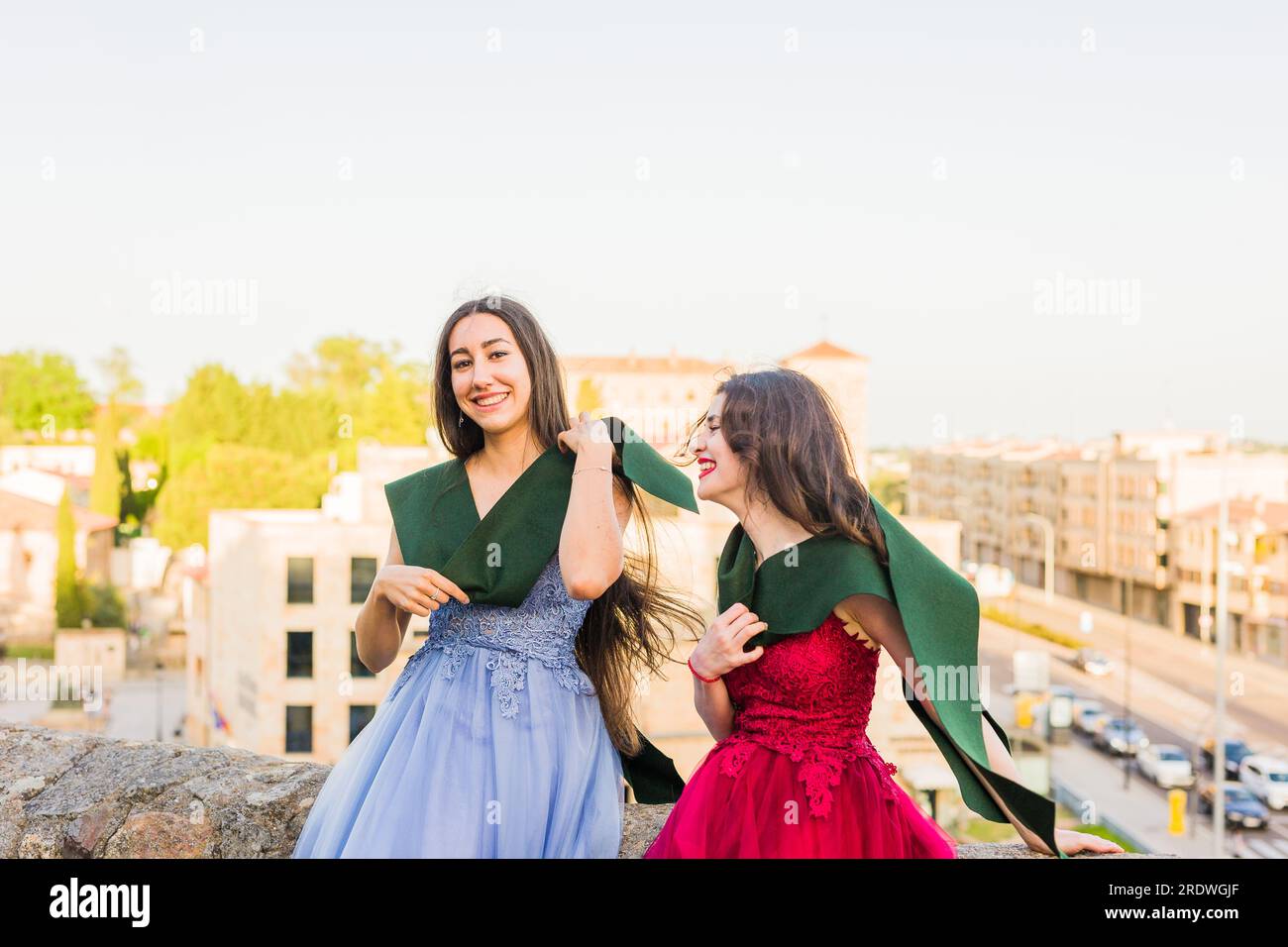 Young Hispanic Students happy celebrating success graduation with stole ...