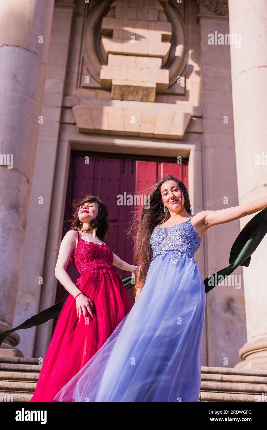 Young Hispanic Students happy celebrating success graduation with stole ...