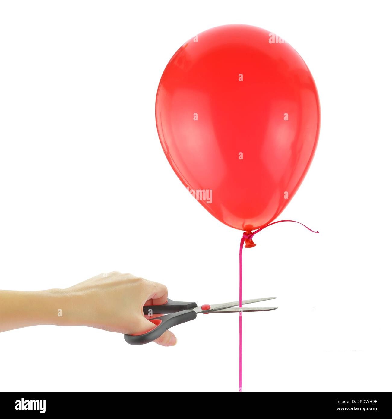 Freedom concept. Hand with a scissor cutting a red balloon ribbon isolated on white Stock Photo ...