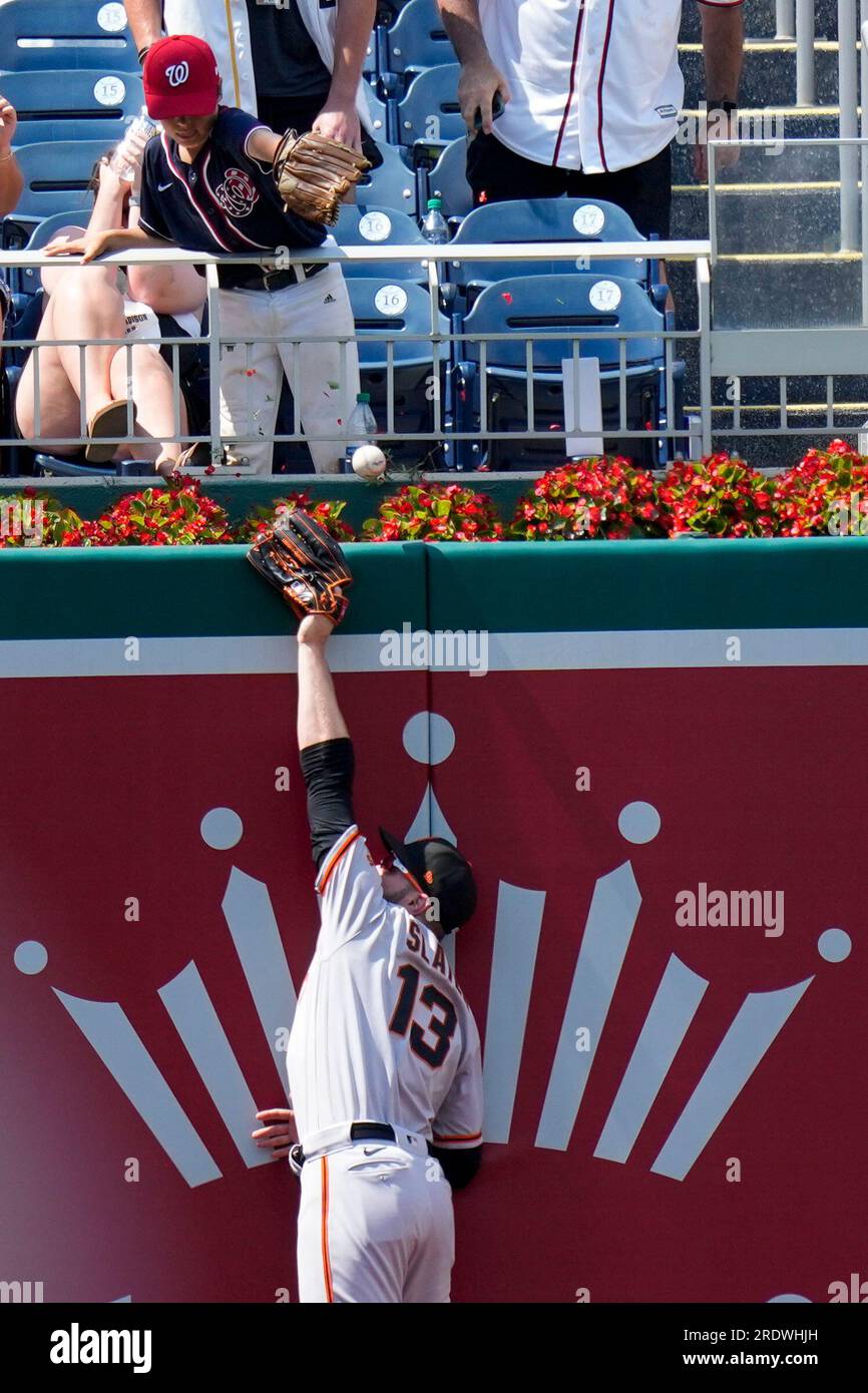 Neither the fan nor San Francisco Giants left fielder Austin Slater (13 ...