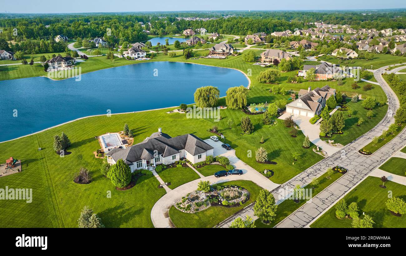 Textured techno road through rich neighborhood property fresh cut grass ...