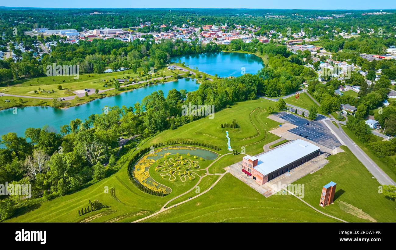 Turquoise pond water in distant summertime aerial over Mount Vernon and ...