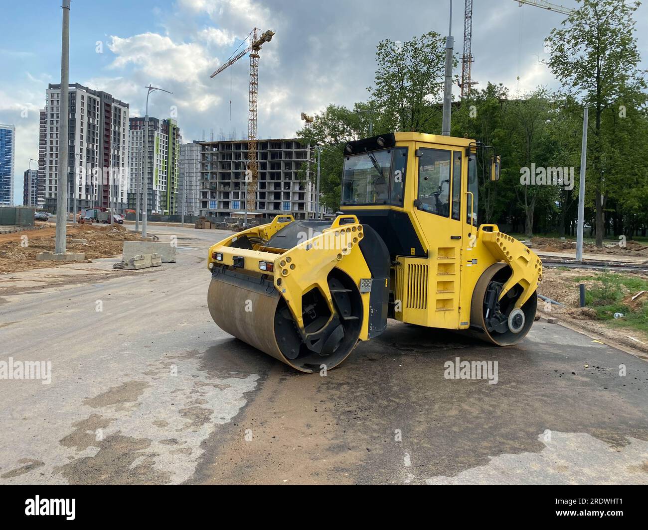 Yellow powerful large new modern road roller for asphalt paving and ...