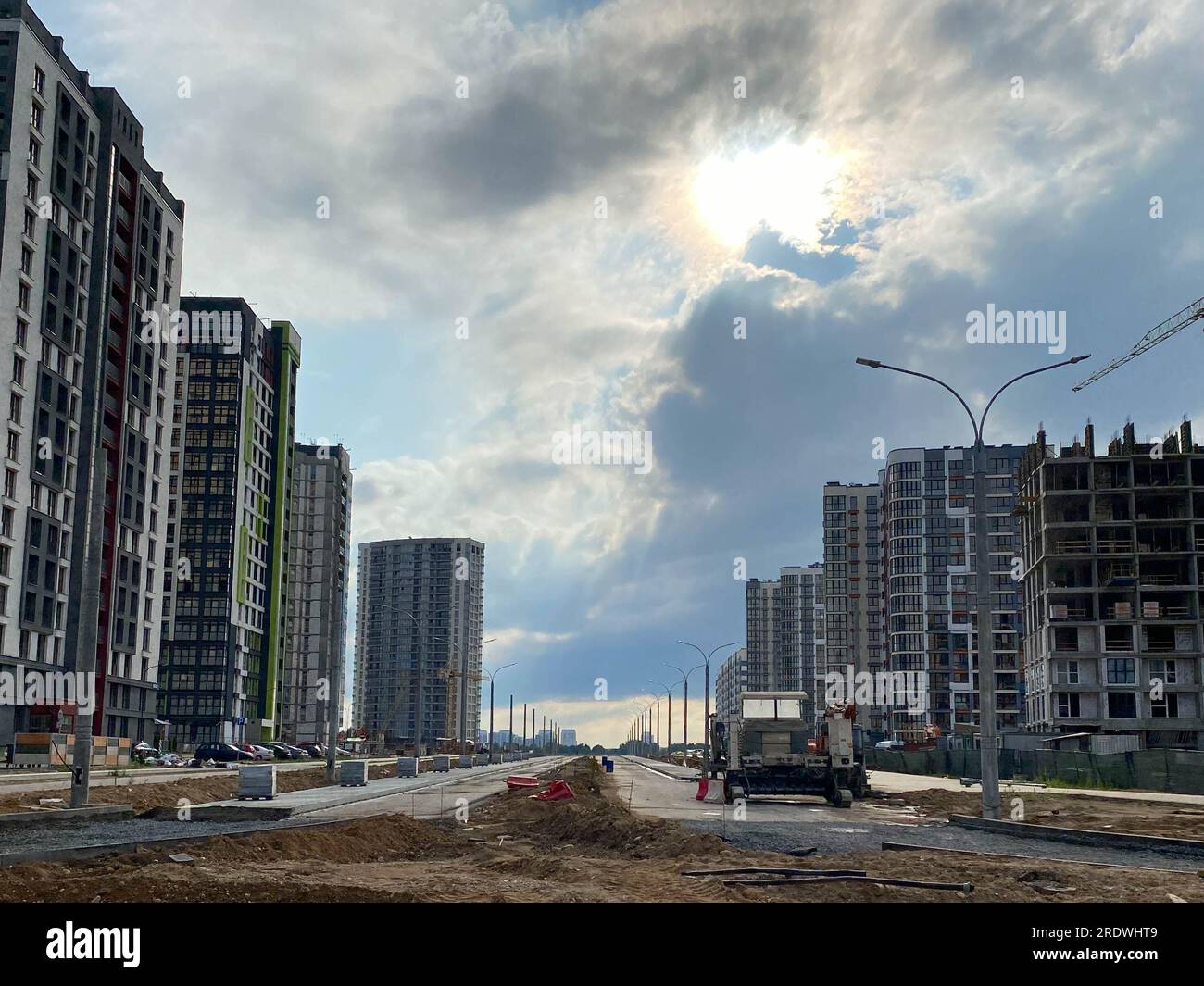 Construction of a wide high road in a new microdistrict of a large city ...