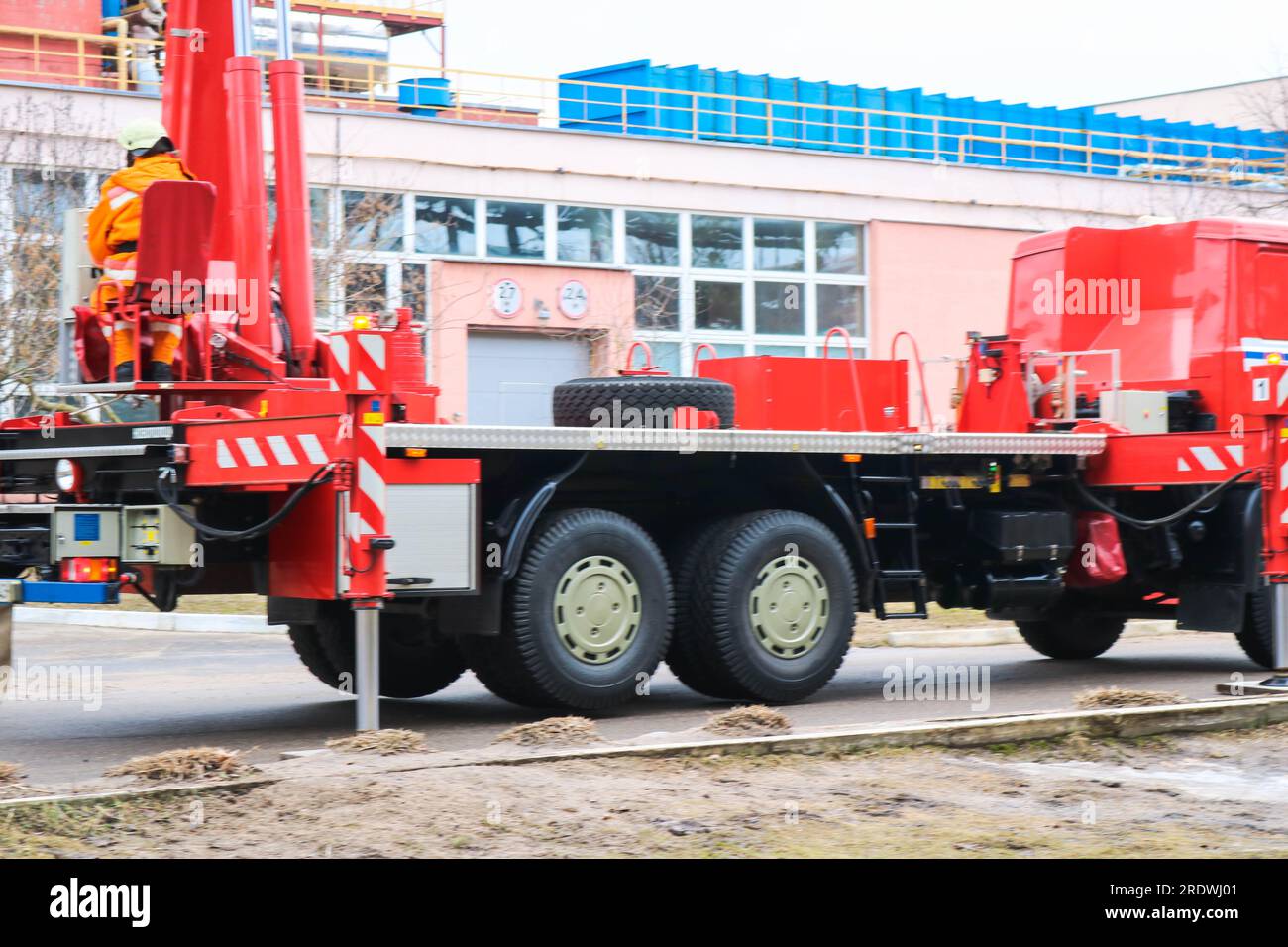 Firefighter rescuers at work in fireproof suits came to extinguish a ...