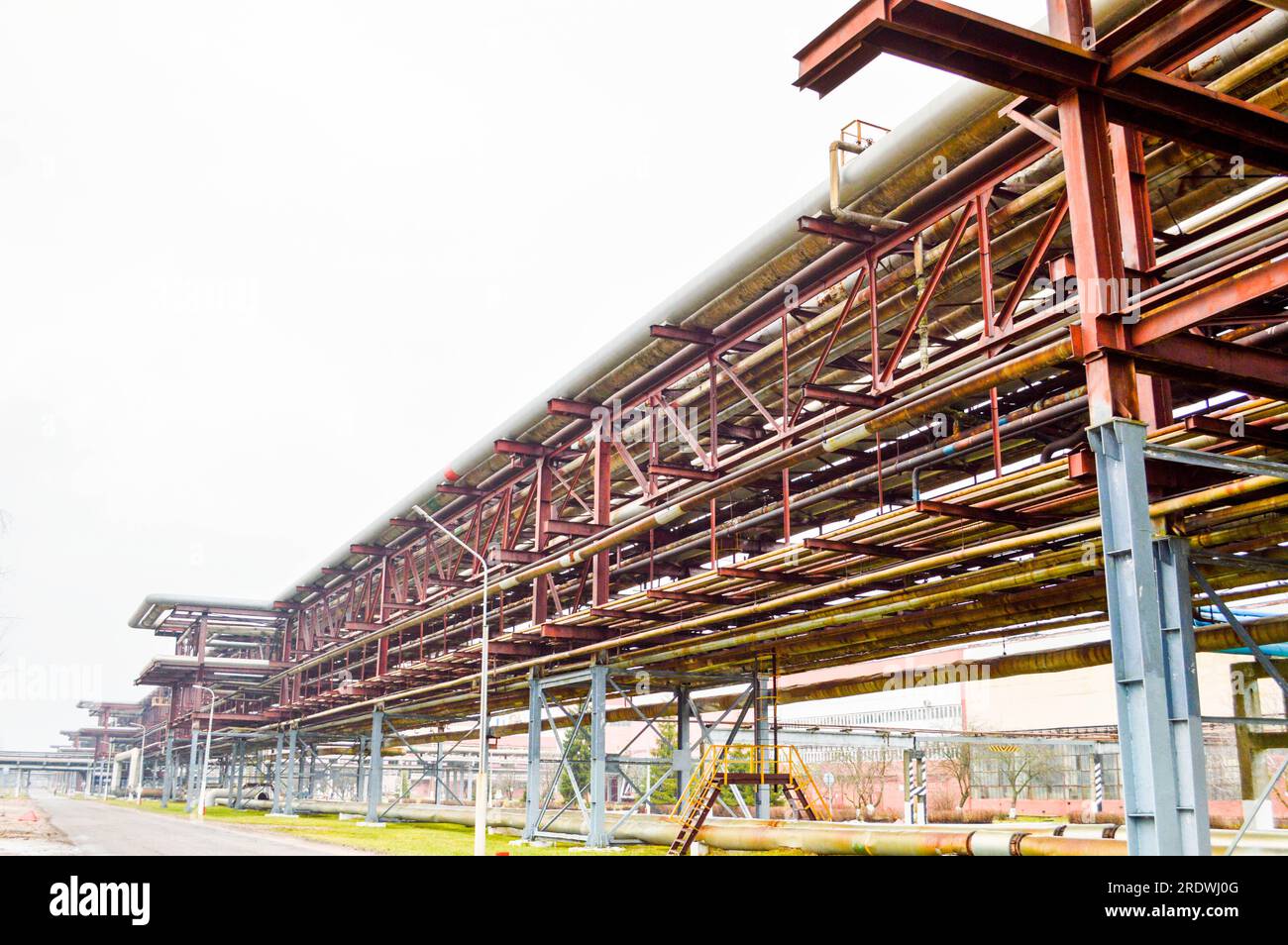 Industrial trestle for pipes. Iron pipes in the oil refinery ...