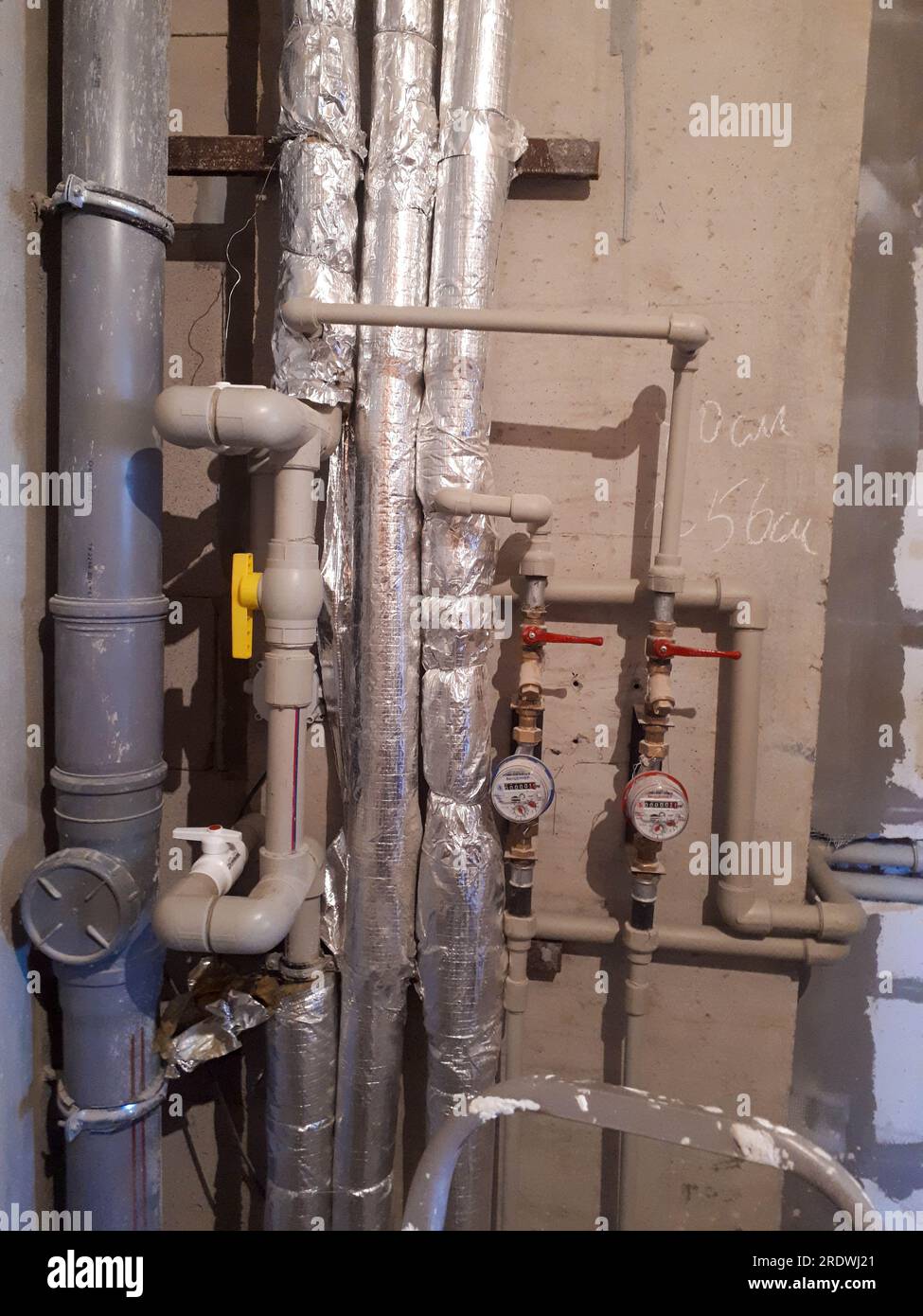 Layout of plastic plumbing pipes with water meters in a new studio ...