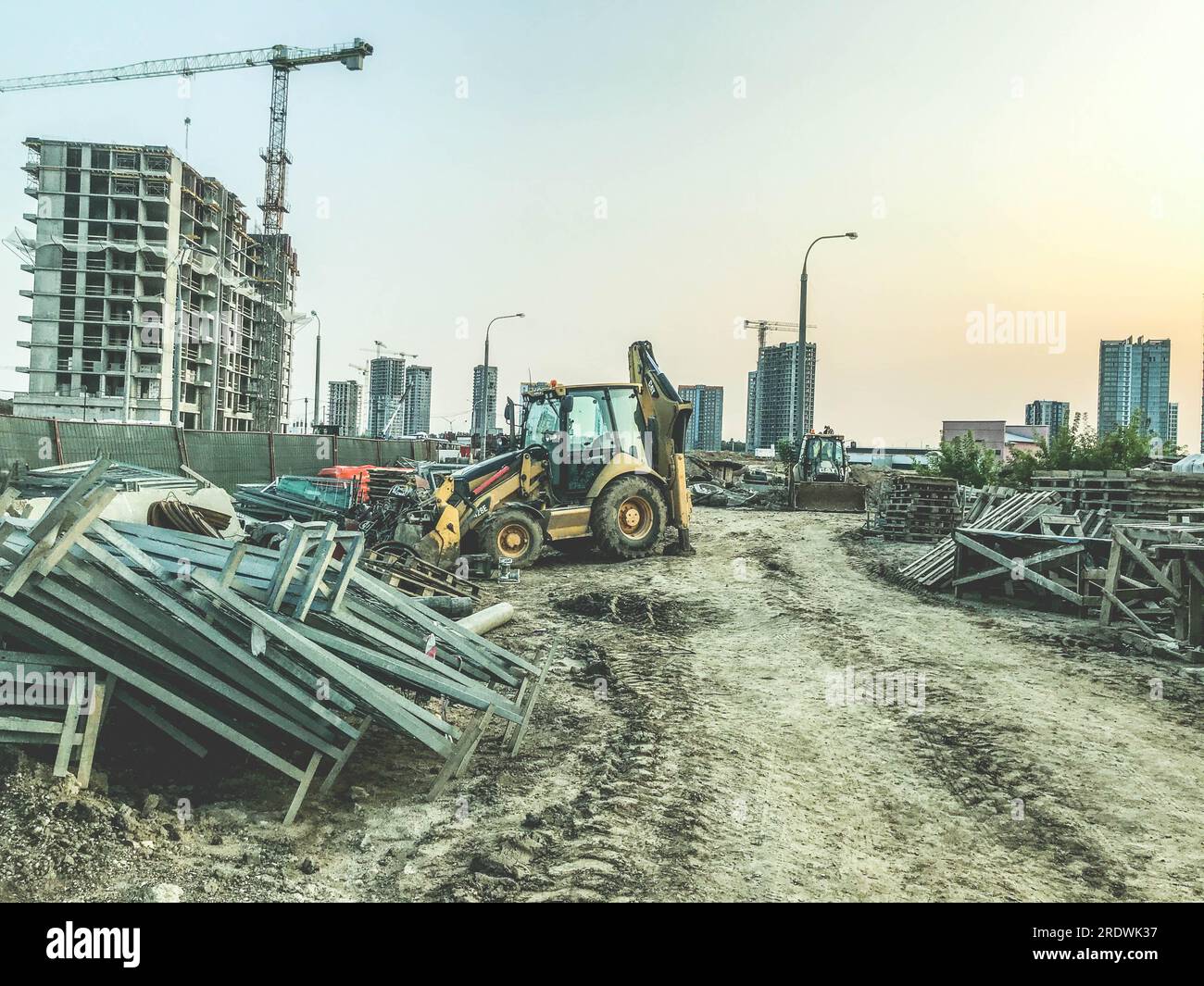 construction site of a new district. yellow construction equipment and ...