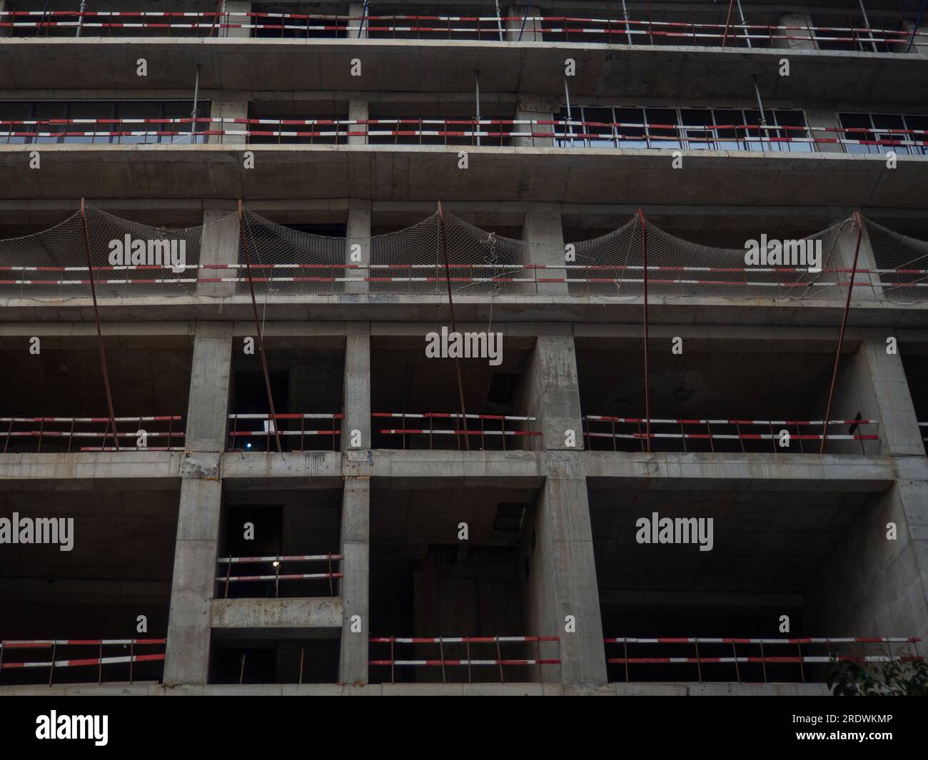 Construction of a tall building. Safety net at a construction site ...