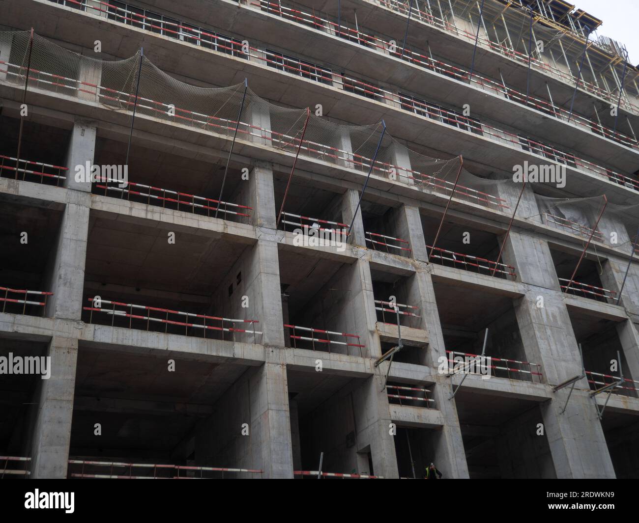 Construction of a tall building. Safety net at a construction site ...